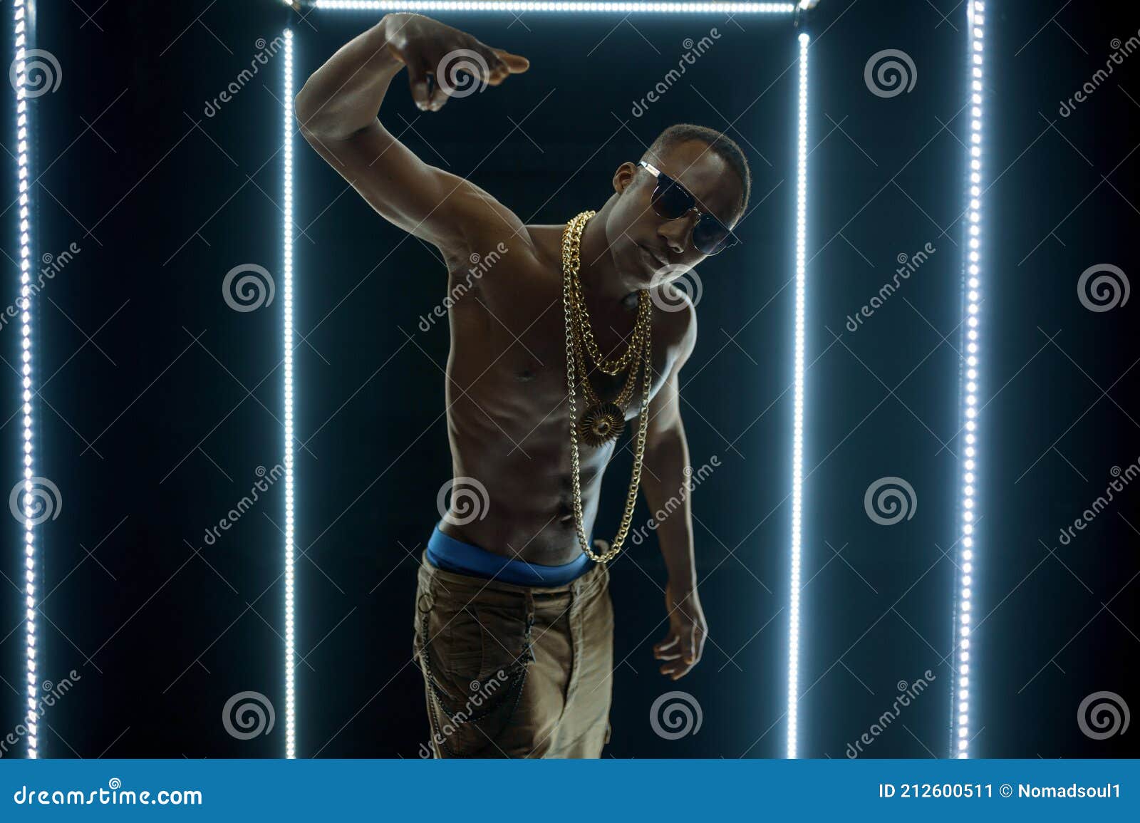 Rapper in Gold Chains Dancing in Illuminated Cube Stock Image - Image ...