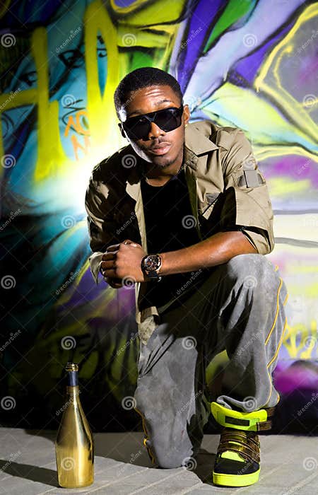 Rapper sitting near wall stock image. Image of lifestyle - 22439177