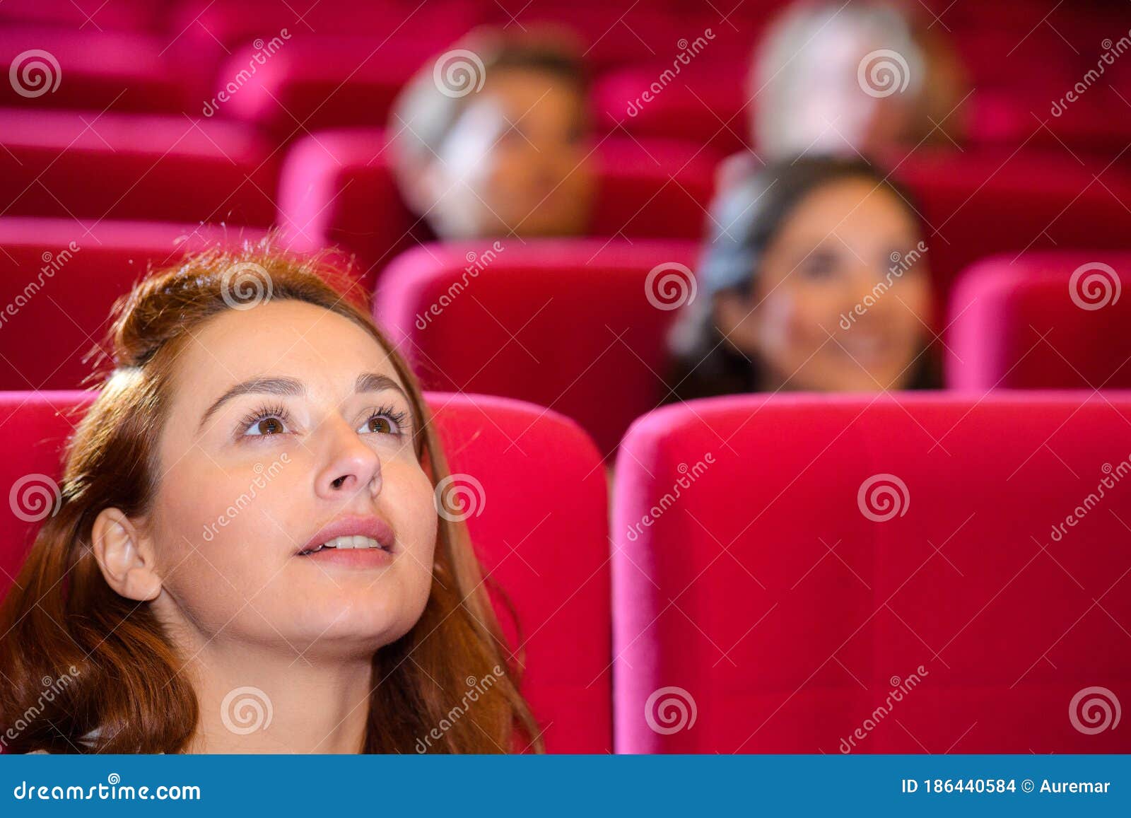 Rapt Woman in Cinema Audience Stock Photo - Image of woman, lookingup ...