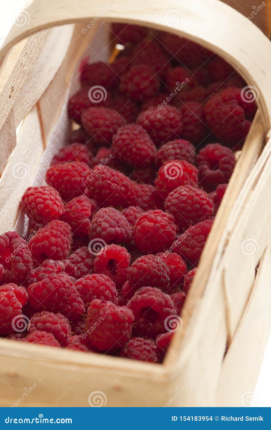Raspberries in basket stock photo. Image of interiors - 154183954