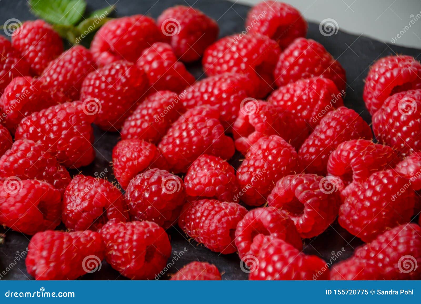 Raspberries on Black Slate Plate Stock Image - Image of fresh ...