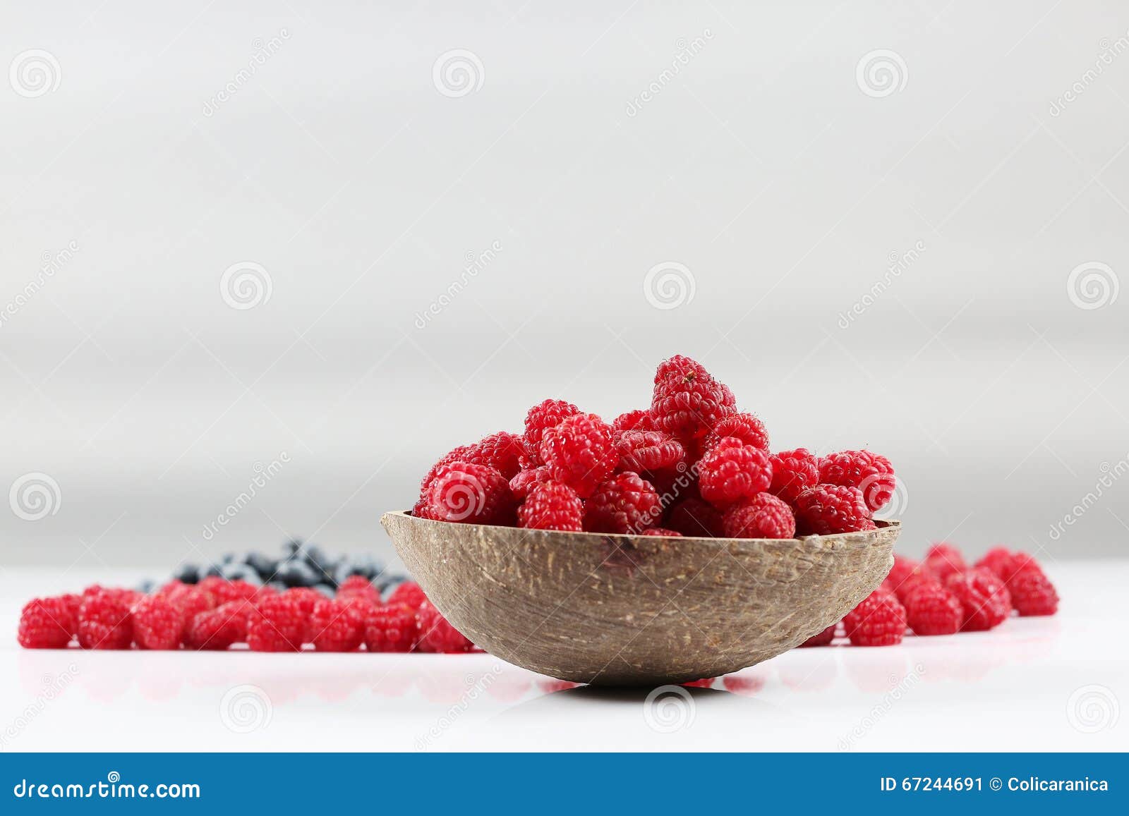 Raspberries in a Coconut Shell Stock Image - Image of background ...