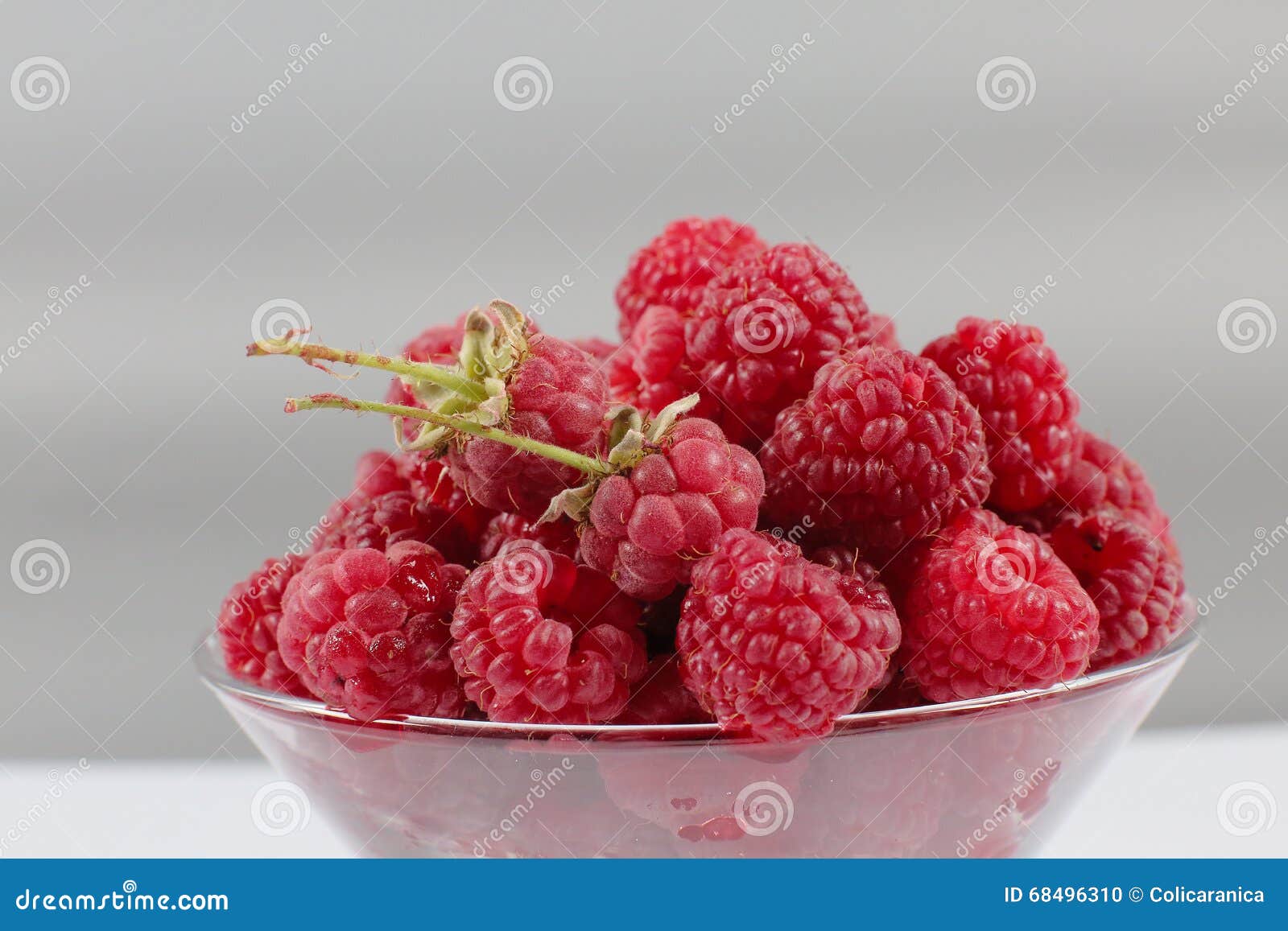 Raspberries in a glass stock photo. Image of raspberries - 68496310