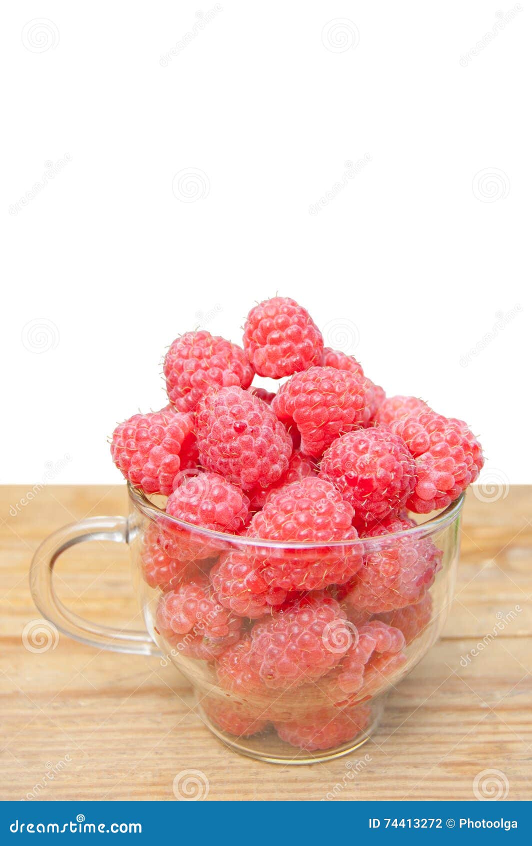 Raspberries in the Glass Cup on the Wood Background Stock Photo - Image ...