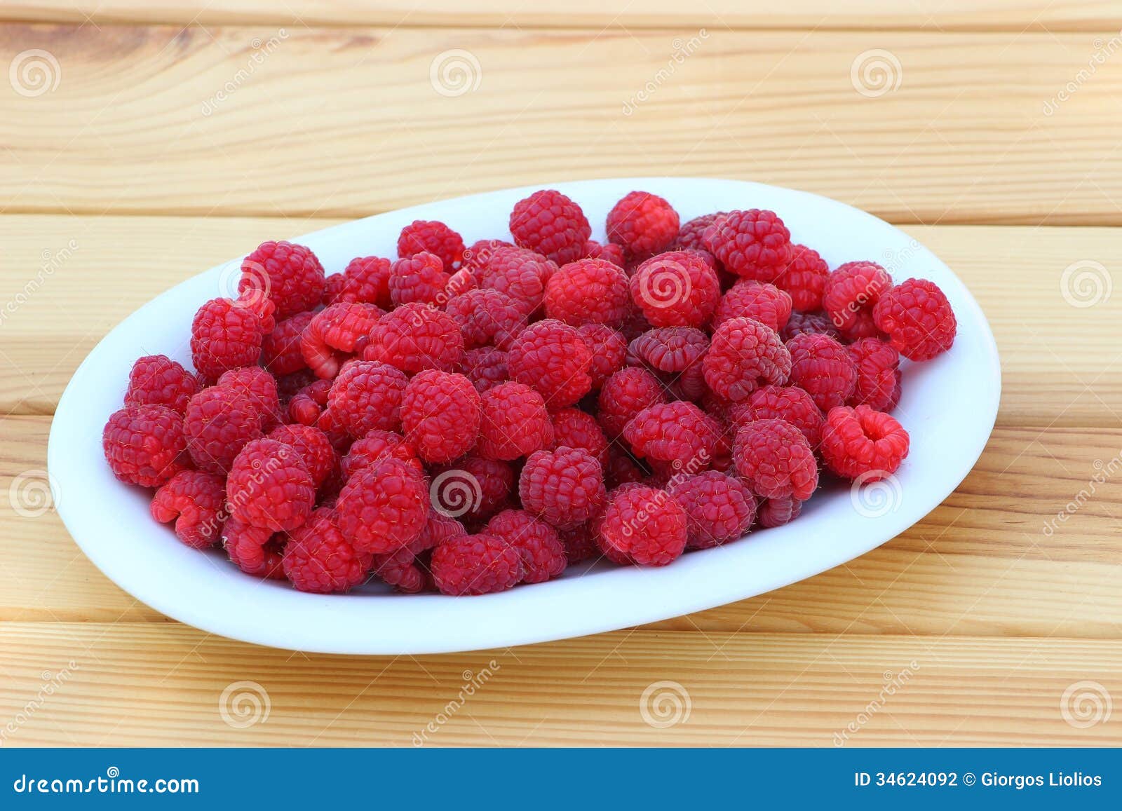 Raspberries in plate stock photo. Image of oval, plate - 34624092