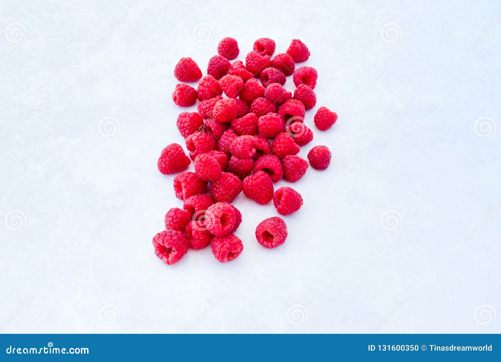 Raspberries Scattered on Light Blue Patterned Background with Copy ...