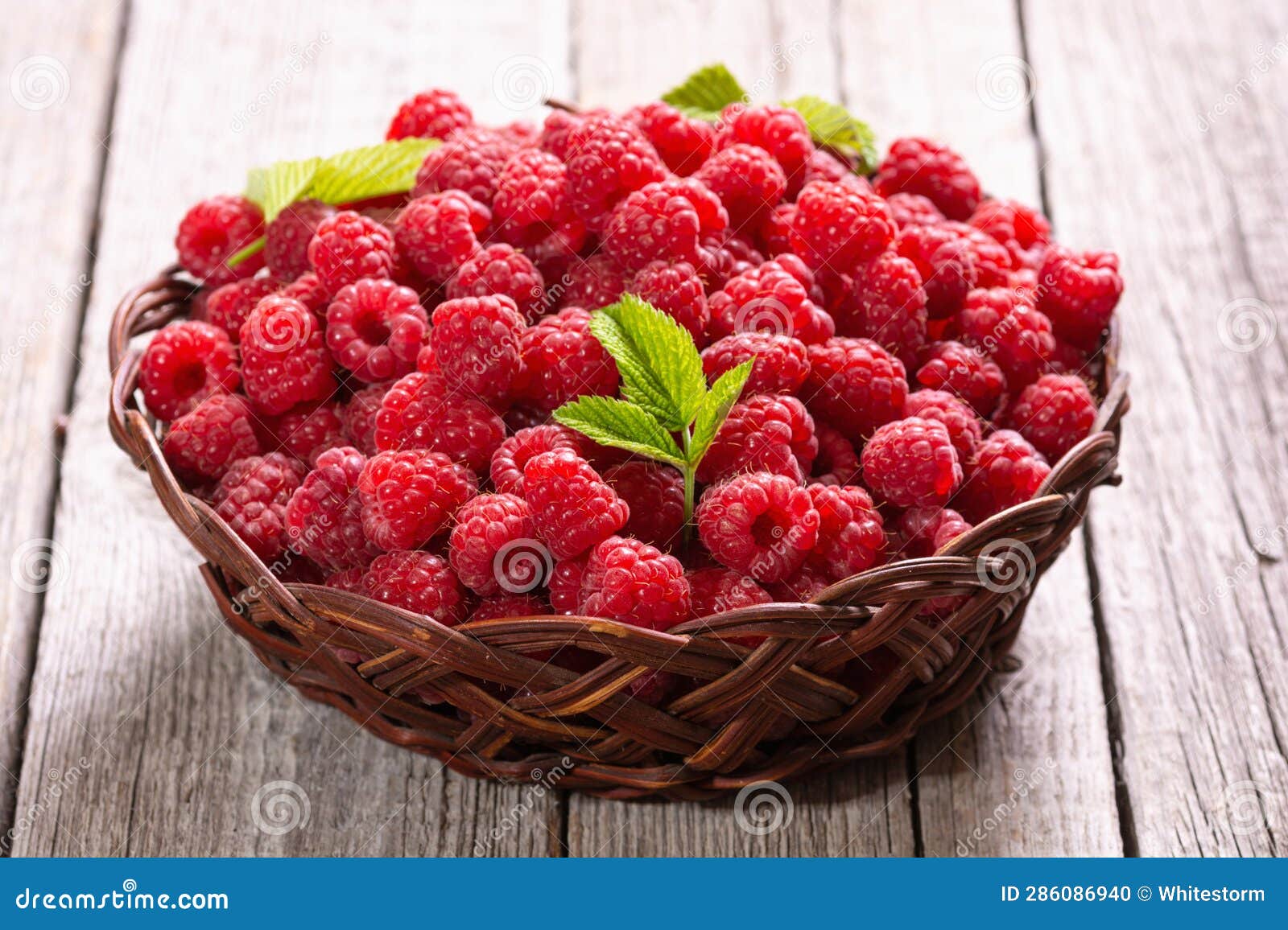 Raspberry in a Basket .on Wooden Background Stock Photo - Image of ...