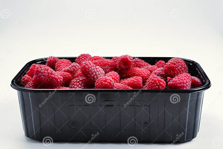 Raspberry in Black Container Isolated on White Background Stock Photo ...