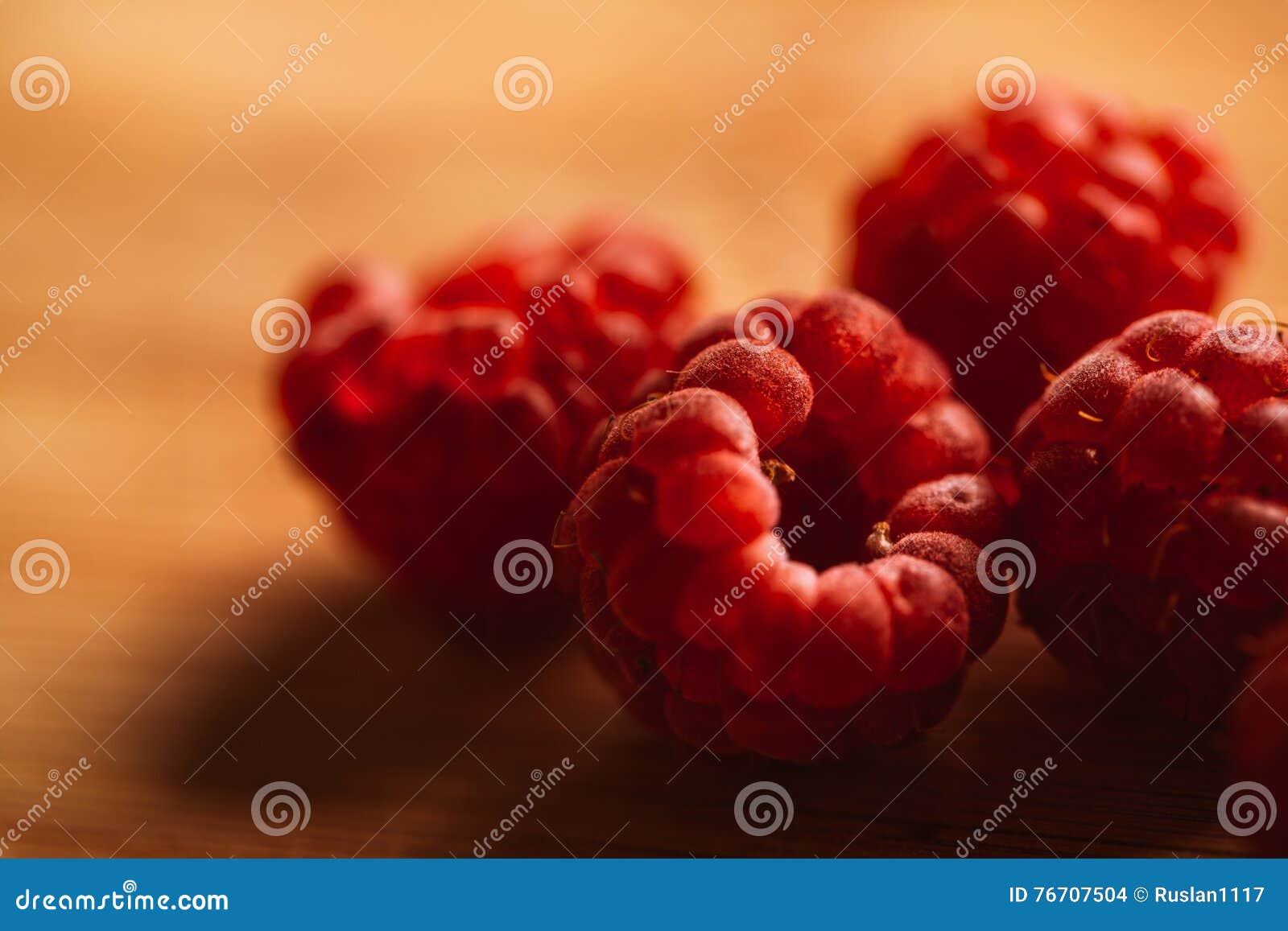 Raspberry on a Blurred Background of Wooden Planks Stock Photo - Image ...