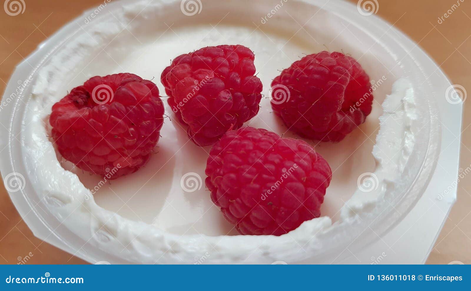Raspberry in a yogurt stock photo. Image of food, milk - 136011018