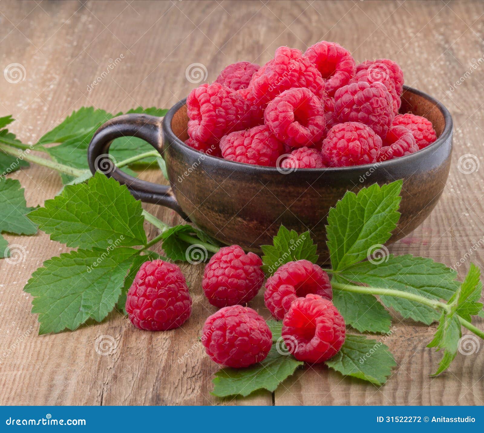 Raspberry in a Cup on Wooden Background Stock Photo - Image of ...