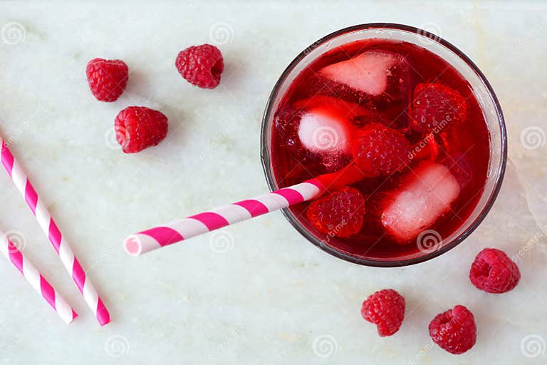 Raspberry Drink with Straw, Overhead View on White Marble Stock Photo ...