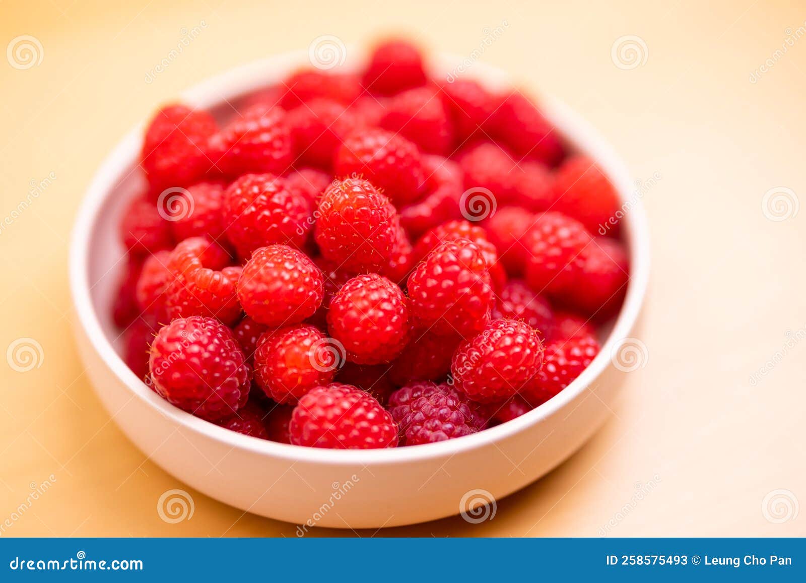 Raspberry fruit on bowl stock image. Image of natural - 258575493