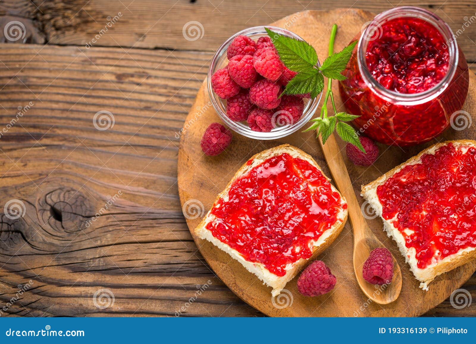 Raspberry jam on the bread stock image. Image of fresh - 193316139