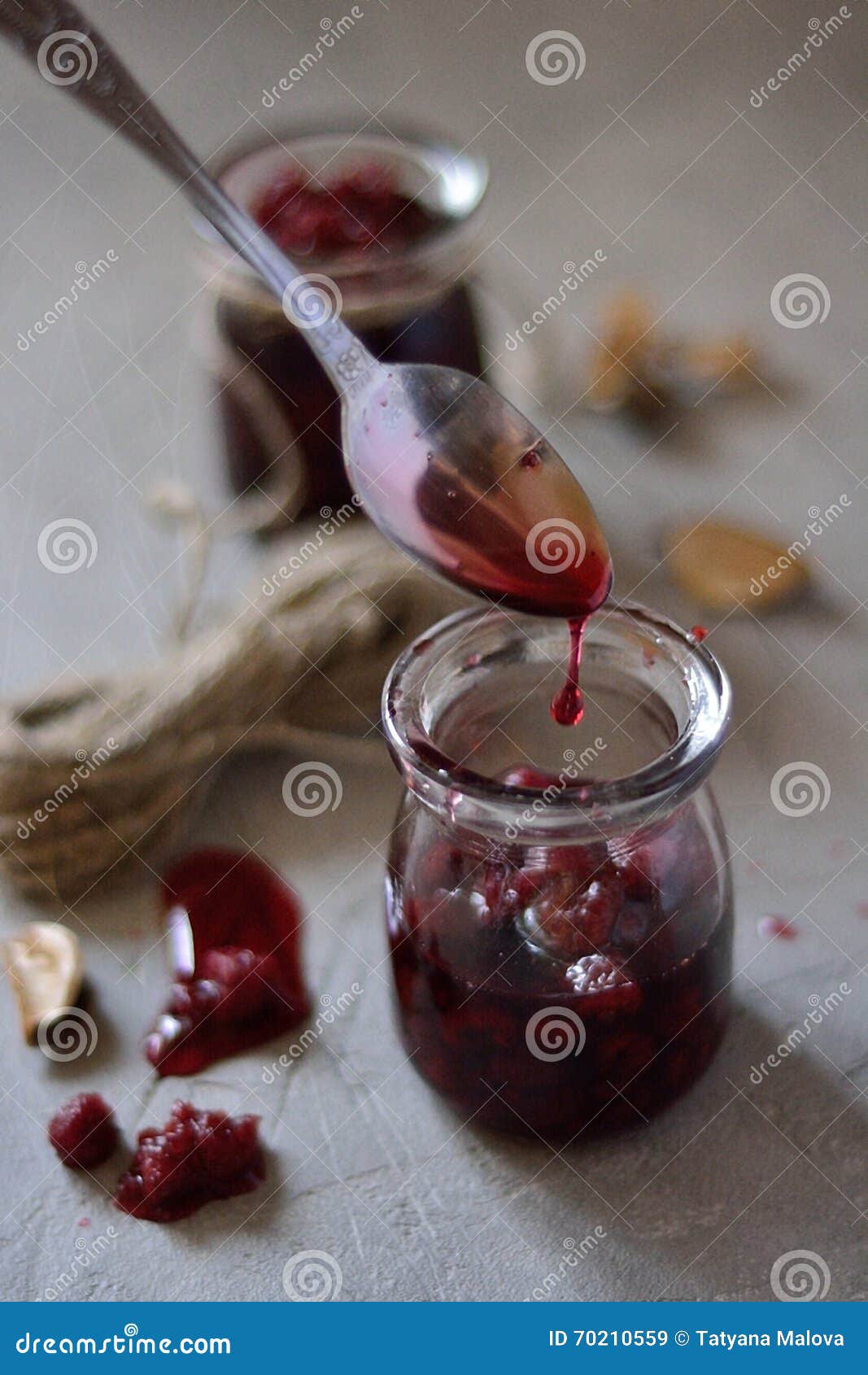 Raspberry Jam Dripping from a Spoon on the Table Stock Image - Image of ...