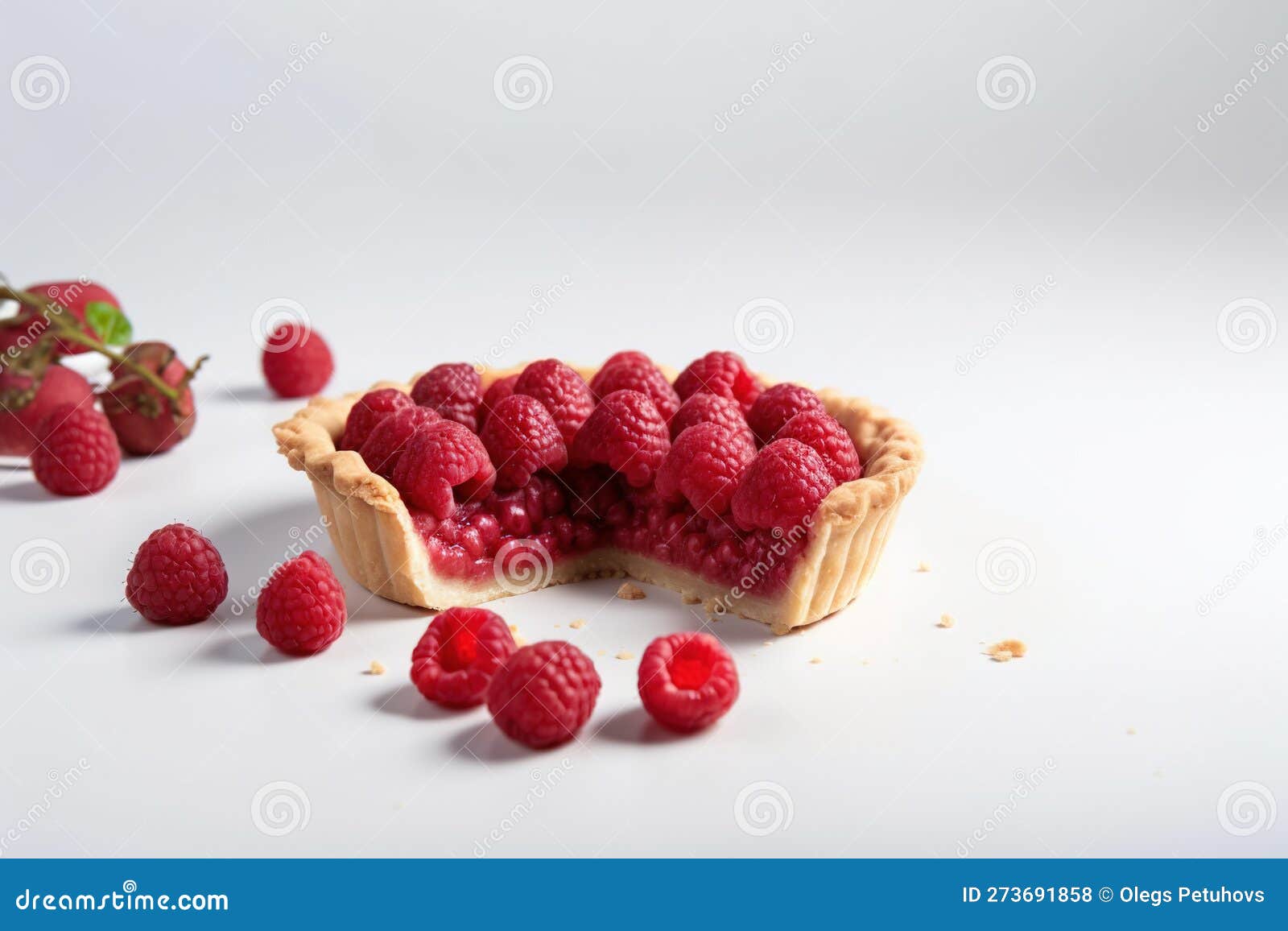 A Raspberry Pie with a Slice Cut Out of it and Some Raspberries ...