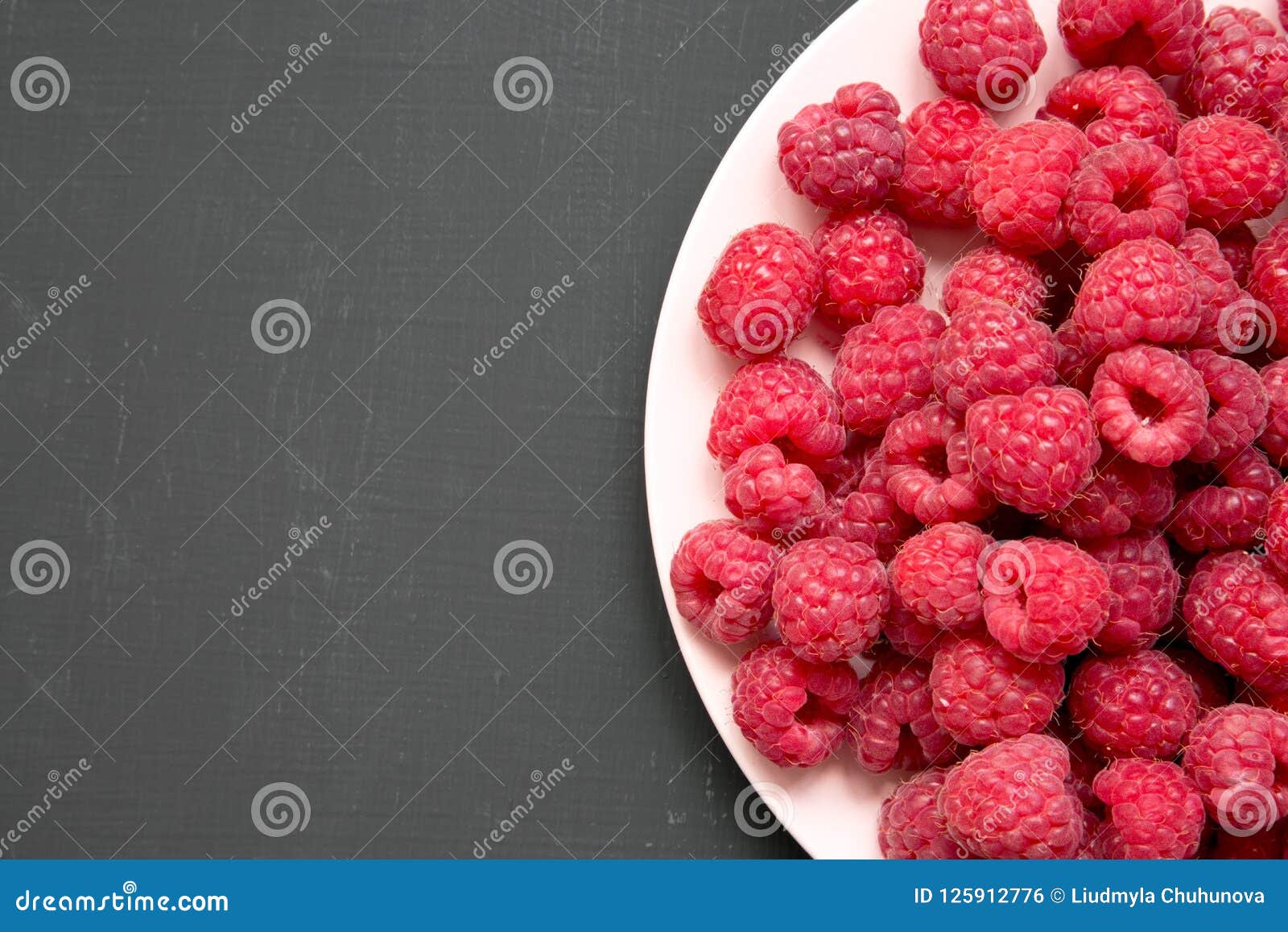 Raspberry on a Pink Plate on Black Table, Top View. Flat Lay, Overhead ...
