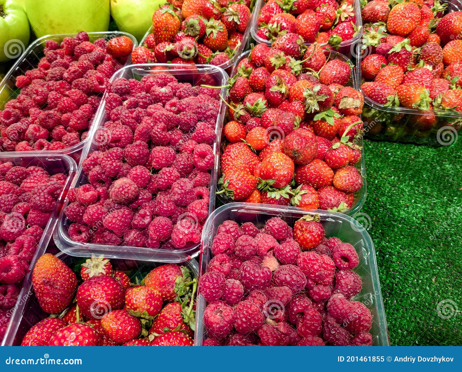 Raspberry and Strawberry in Pans on Sale at a Grocery Store Display ...