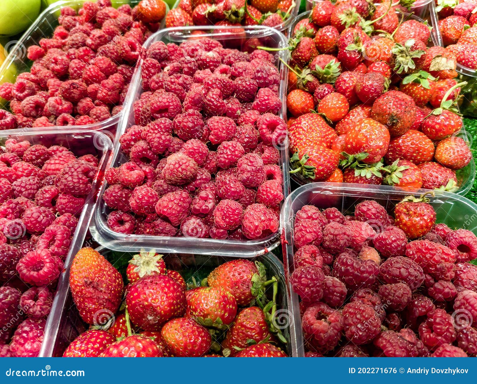Raspberry and Strawberry in Pans on Sale at a Grocery Store Display ...