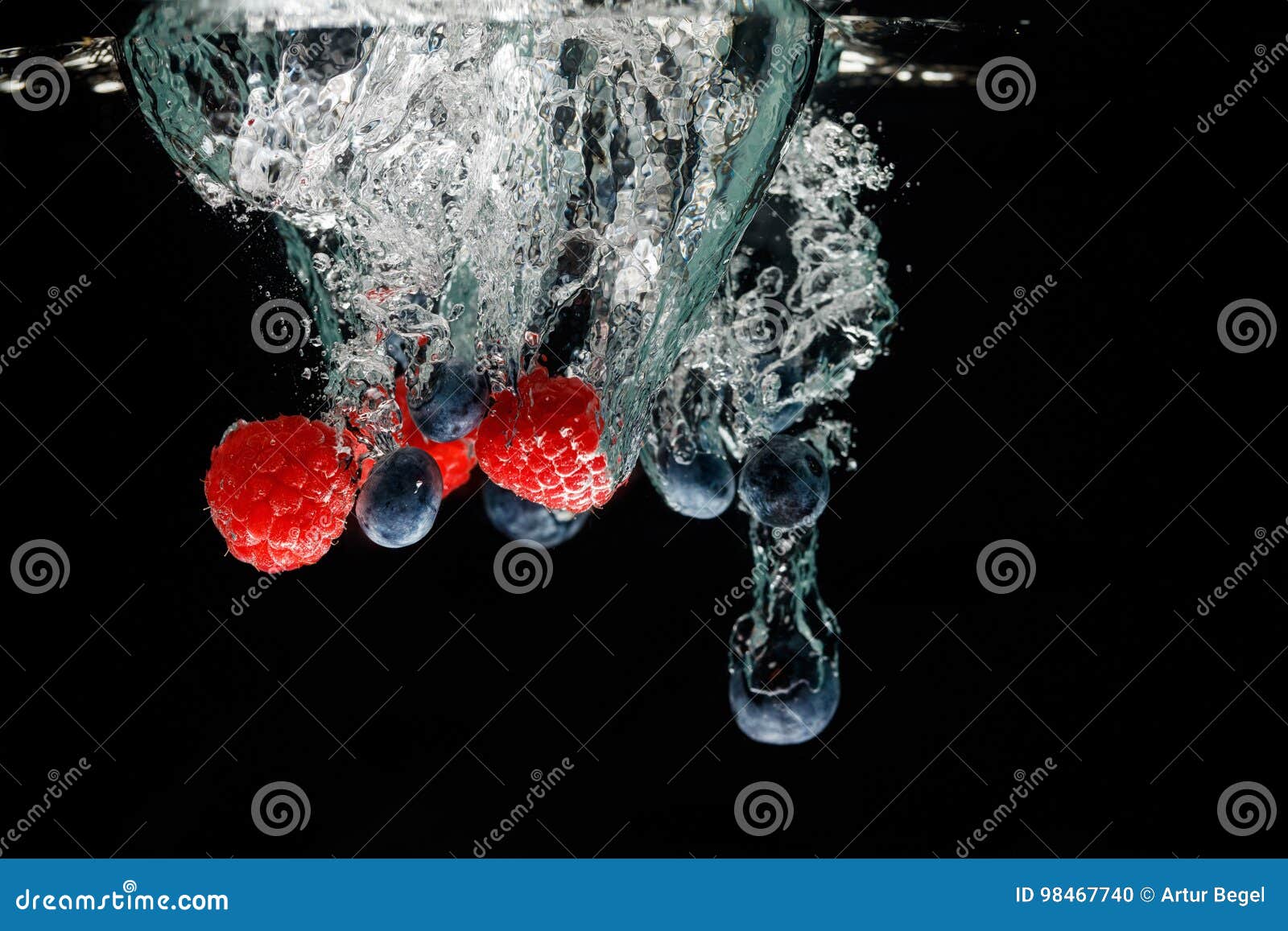 Raspberrys and Blueberry Falls Deeply Under Water with a Big Splash ...