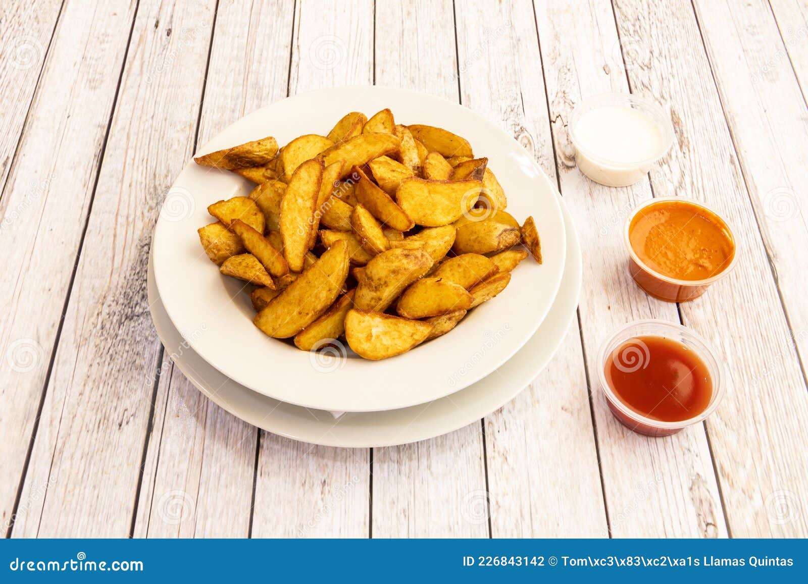 Ration of Potato Chips Wedges with Assorted Sauces for Dipping Stock ...
