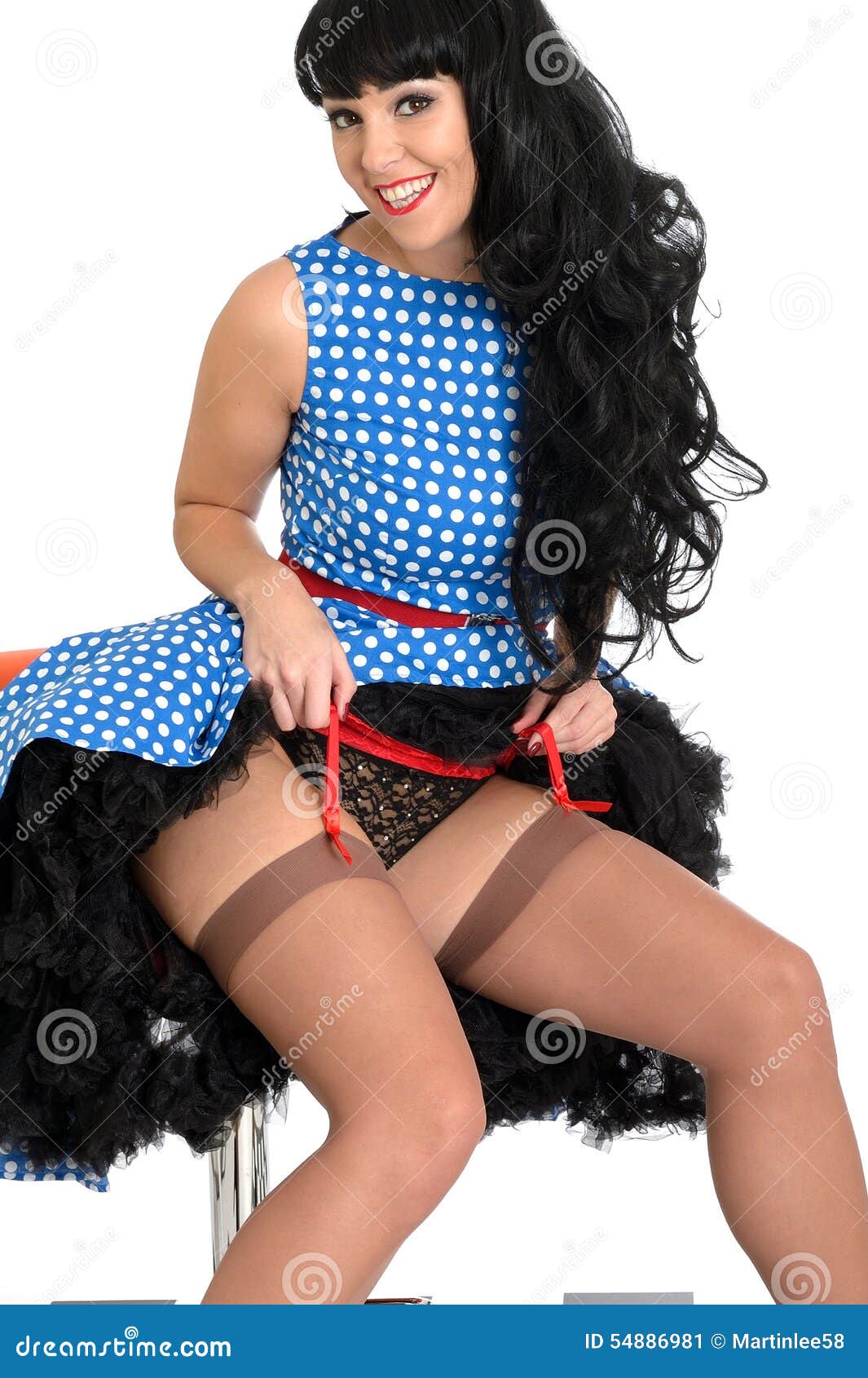 Raunchy Glamorous Young Vintage Pin Up Model Posing In Red Suspender