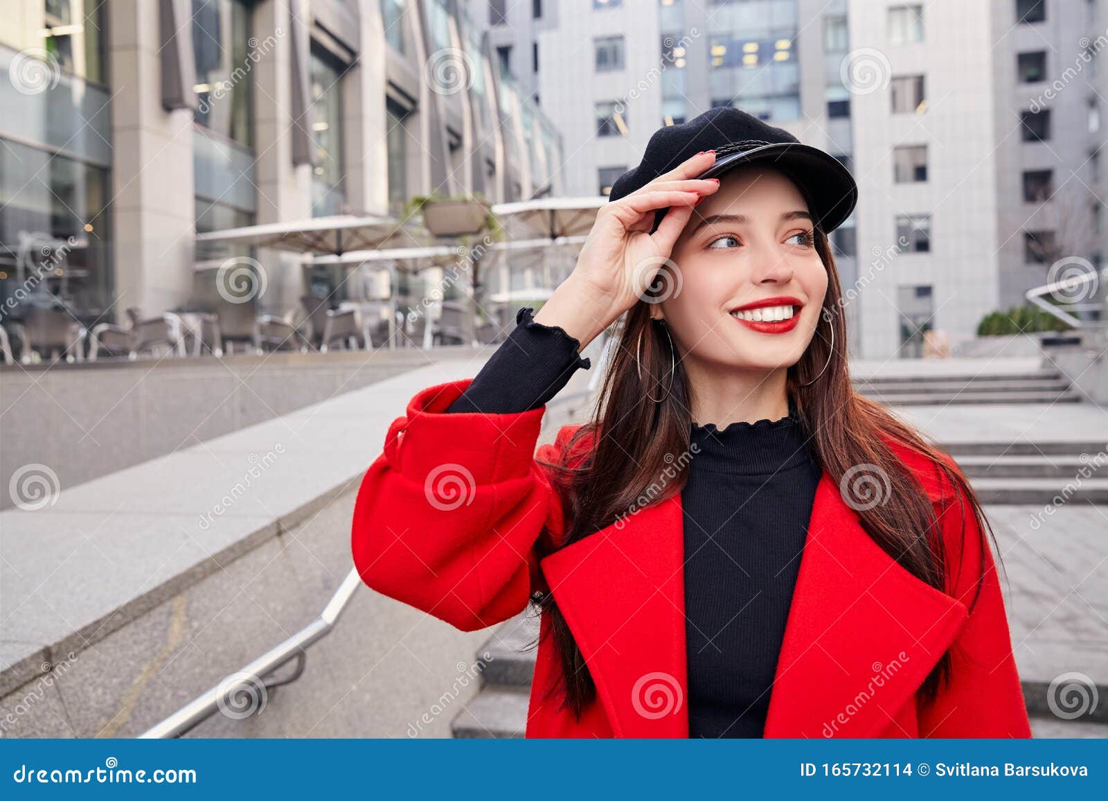 Admirable Ravishing Dreamy Girl Holds Her Black Kepi By Hand And Looks
