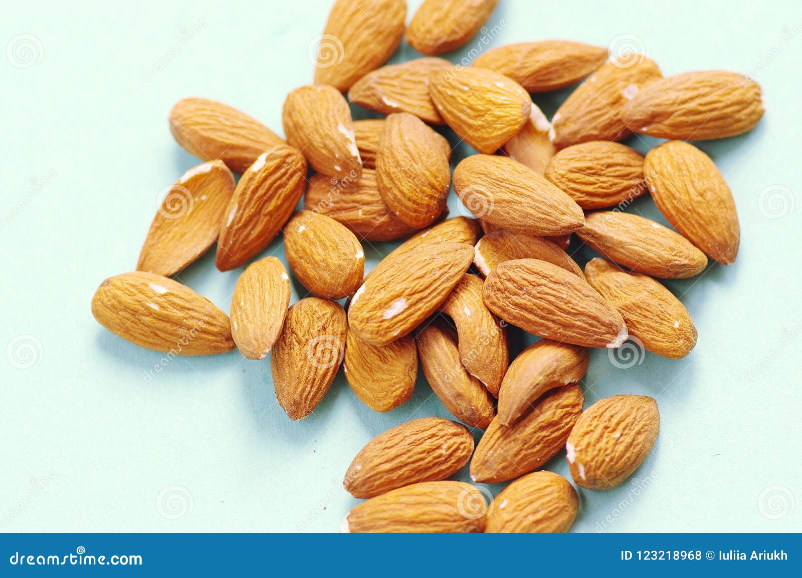 Raw Almonds on the Blue Background. Stock Photo - Image of close, macro ...