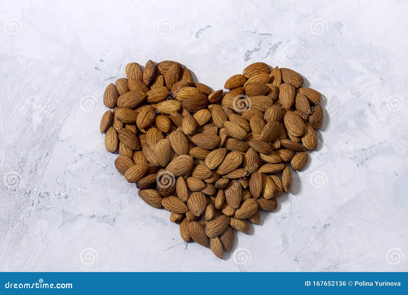 Raw Almonds in Heart Shape. Top View. White Background Stock Photo ...