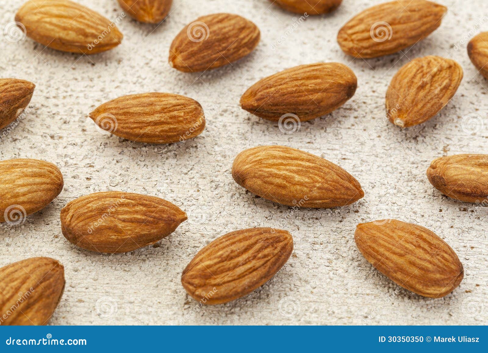 Raw almonds on white wood stock photo. Image of rough - 30350350