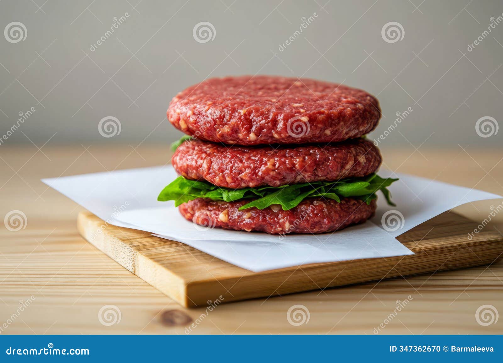 Raw Beef Burger Patties Stacked with Parchment Paper Stock Photo ...