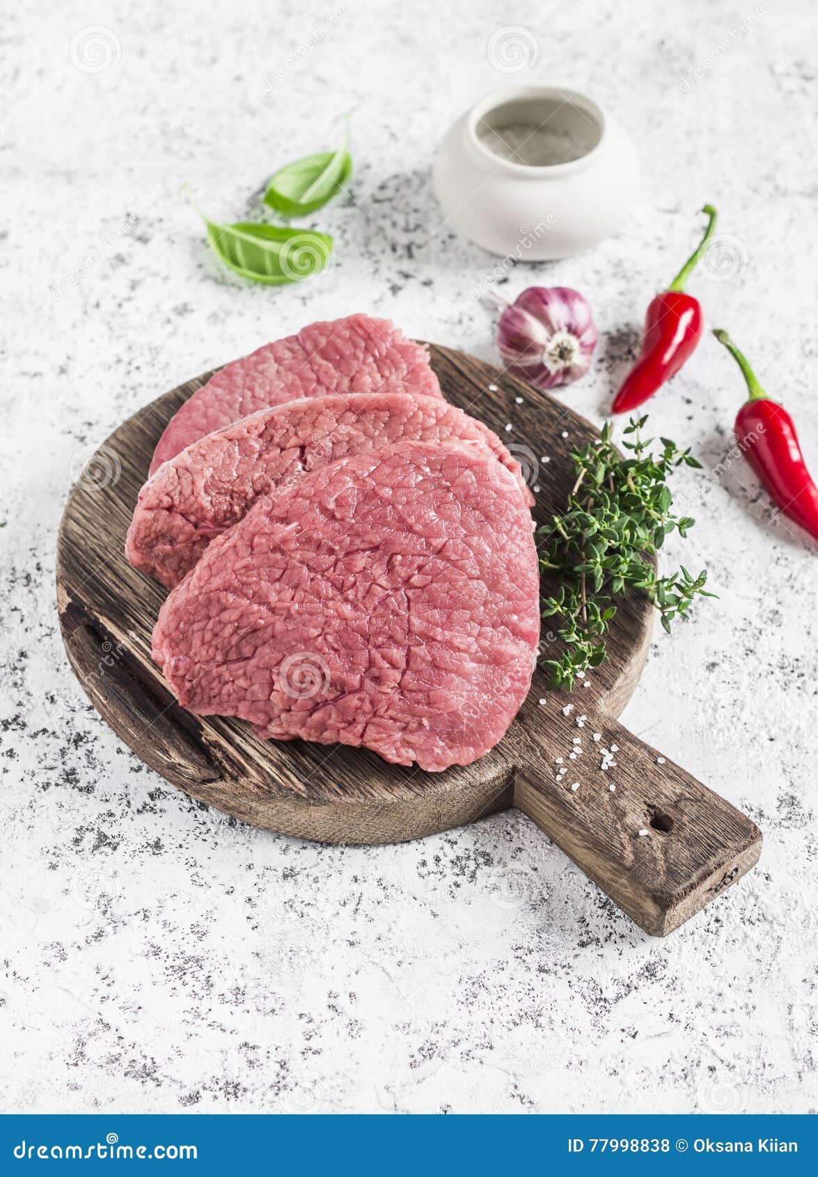 Raw Beef Chops on a Wooden Cutting Board Stock Photo - Image of ...
