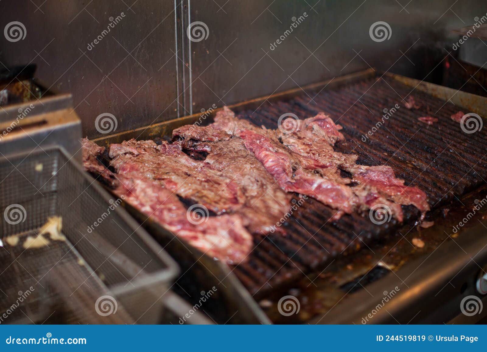 Raw Beef Cooking on an Indoor Grill at a Mexican Restaurant Stock Image ...