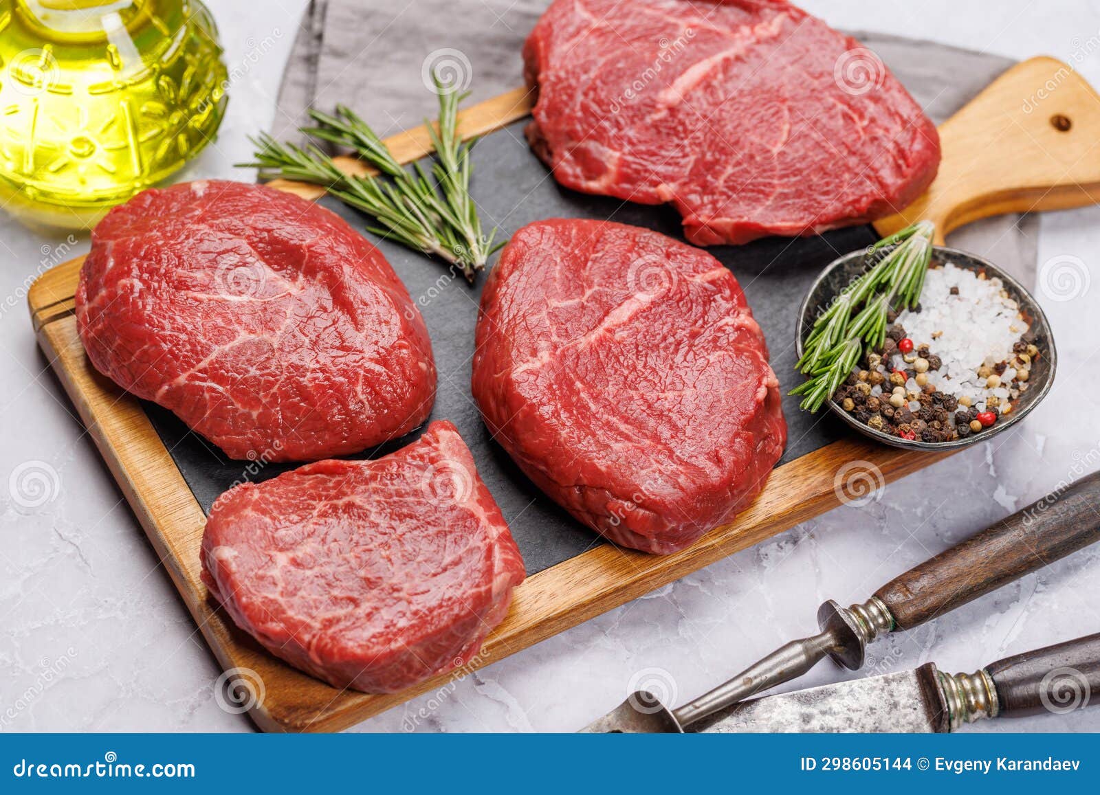 Raw Beef Fillet Steaks on a Board, Fresh and Uncooked Stock Photo ...