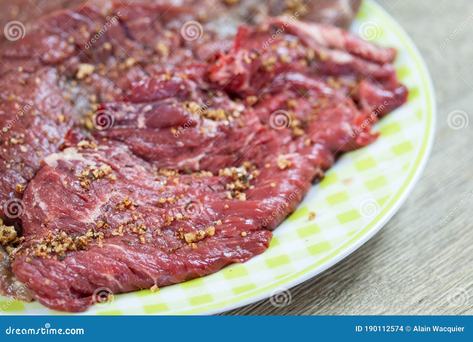 Raw beef flank on a plate stock photo. Image of dinner - 190112574