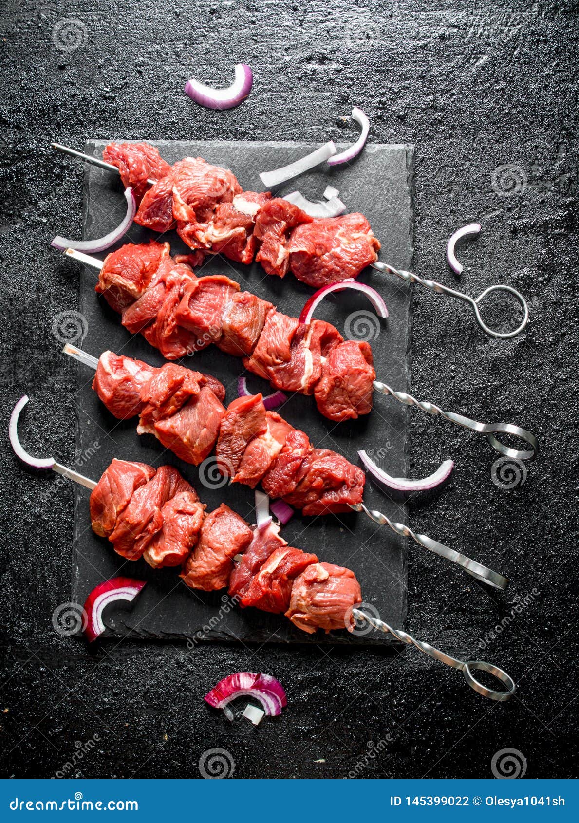 Raw Beef Kebab on a Stone Board with Pieces of Onions Stock Photo ...