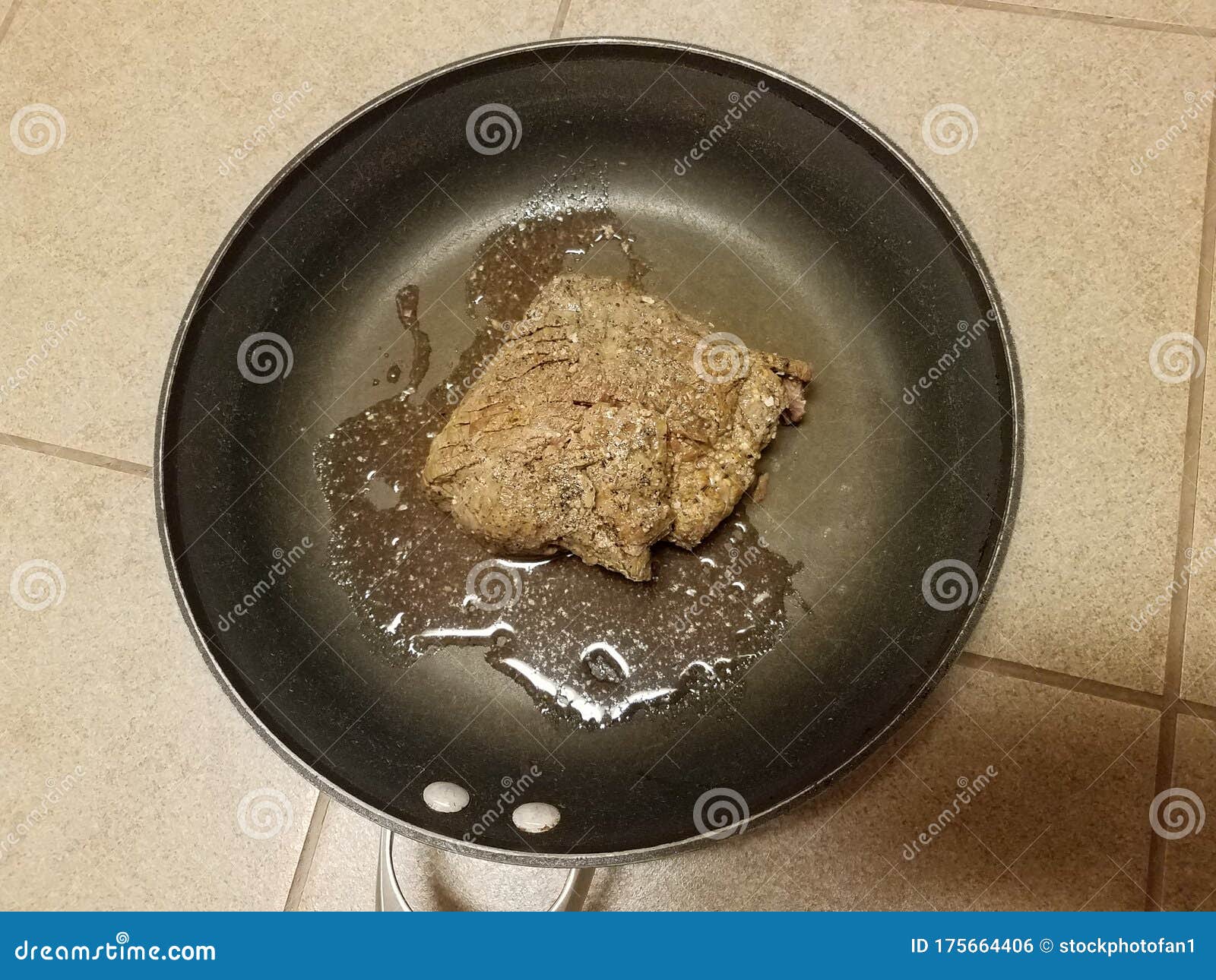 Raw Beef Meat in Frying Pan on Tile Floor Stock Photo - Image of meat ...