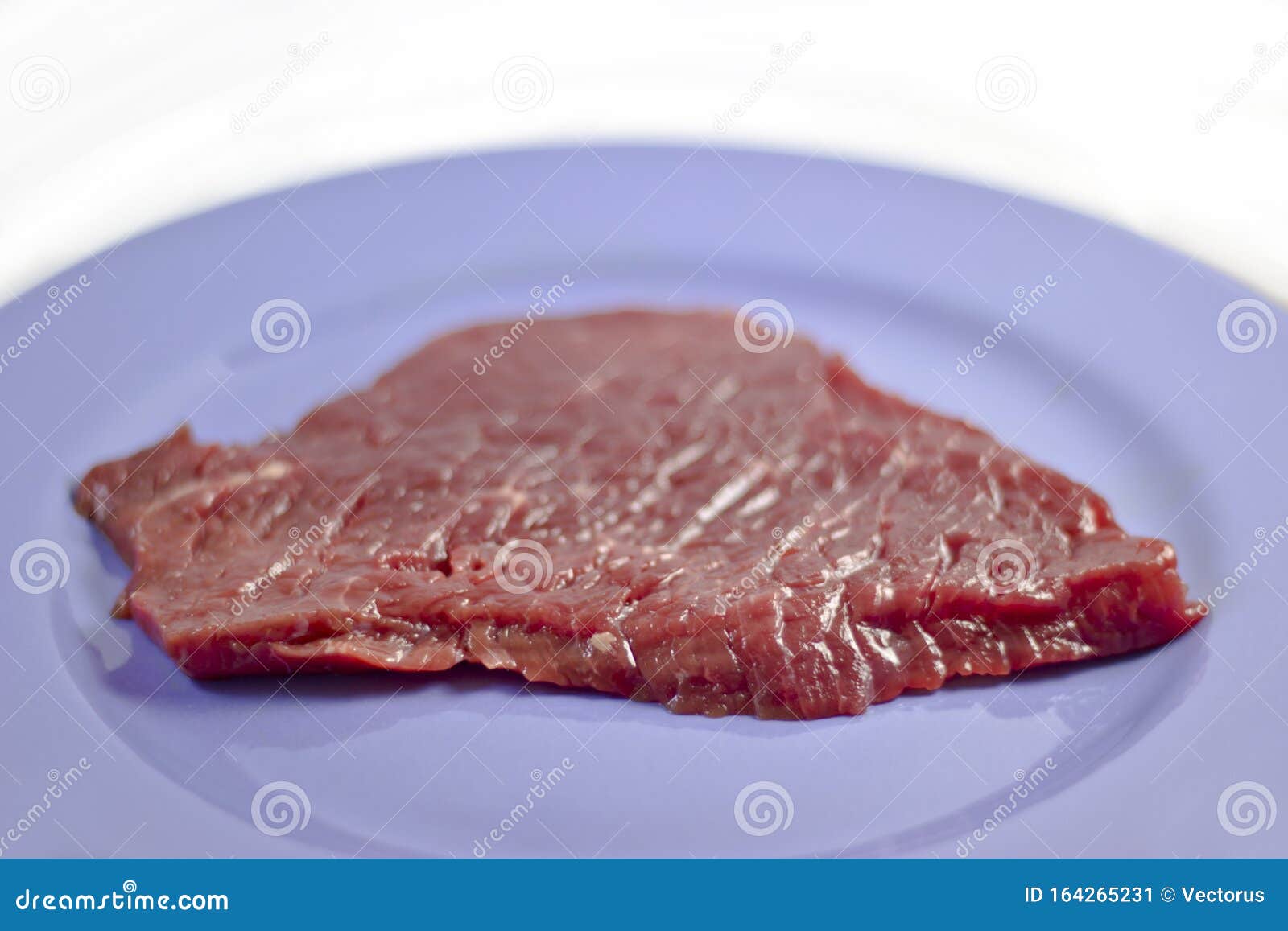 Raw Beef Meat in a Purple Plate Stock Image - Image of beef, plate ...