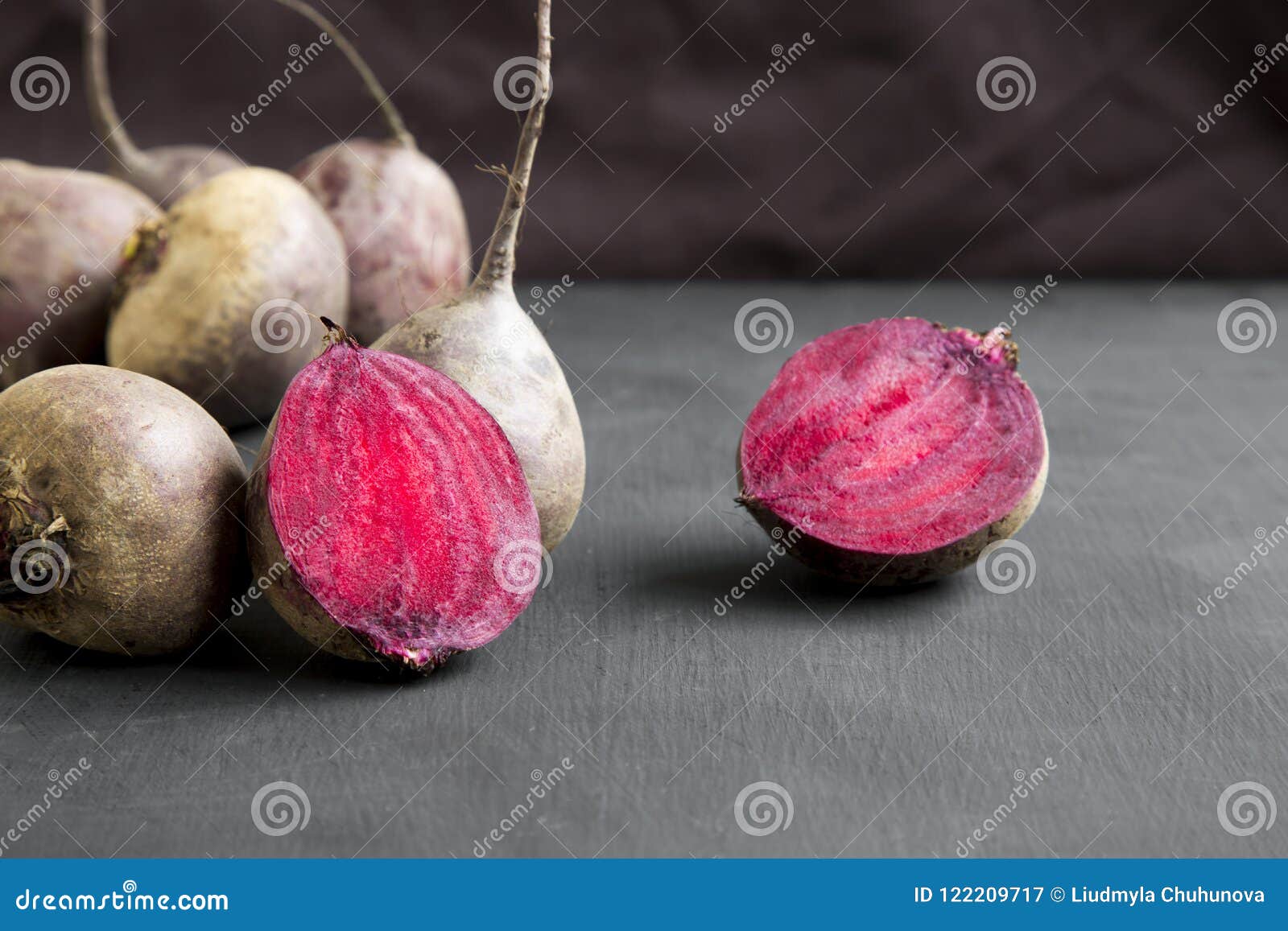 Raw Beetroot and Two Halves on Black Background, Side View. Stock Image ...
