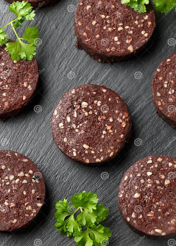 Raw Black Pudding with Parsley on Rustic Stone Board Stock Photo ...