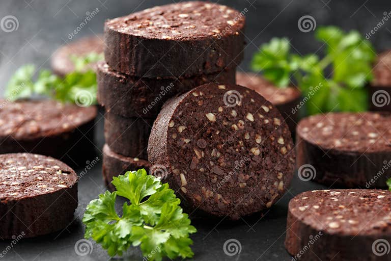 Raw Black Pudding with Parsley on Rustic Stone Board Stock Image ...