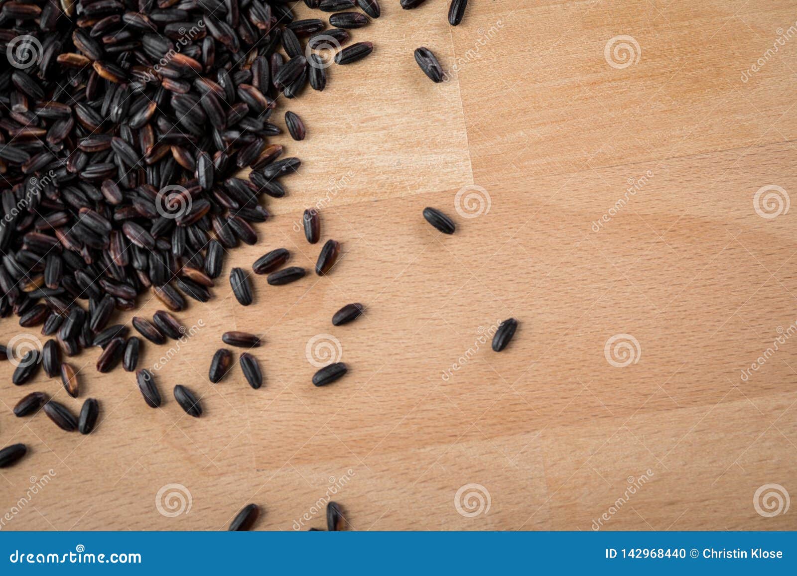 Raw Black Rice on Wooden Background Stock Photo - Image of cuisine ...