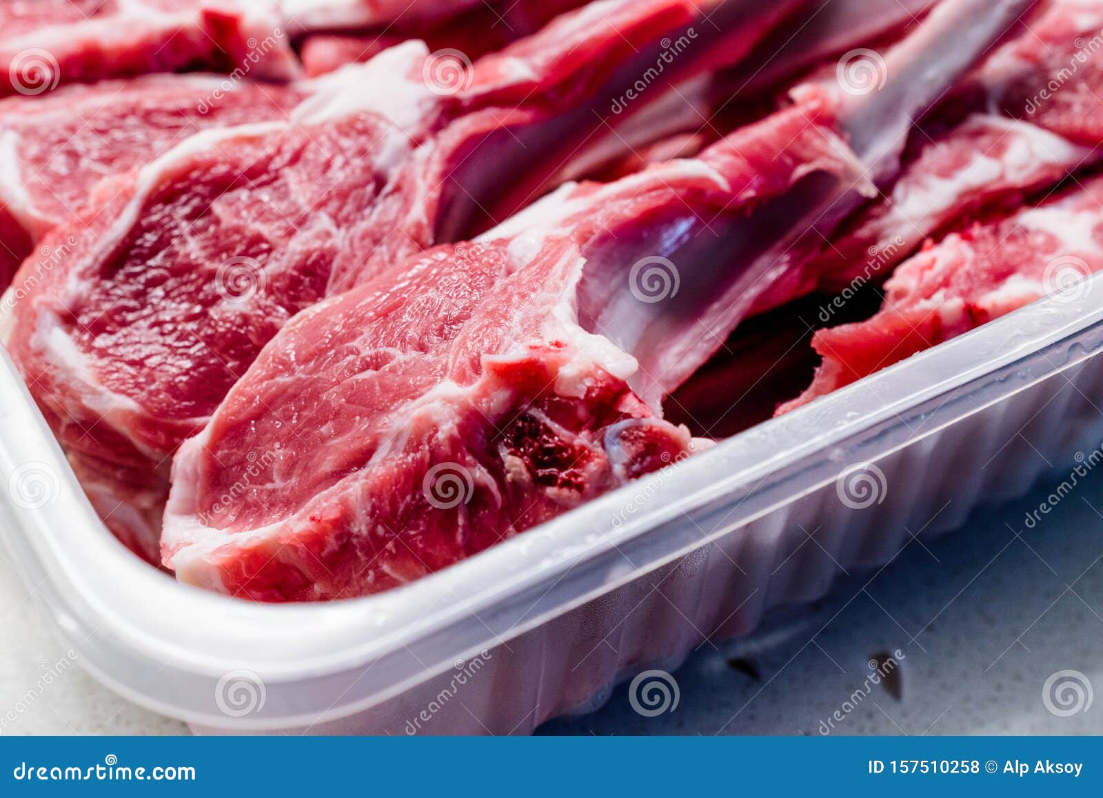 Raw Bloody Lamb Chops Meat in Plastic Package / Box or Container Stock ...