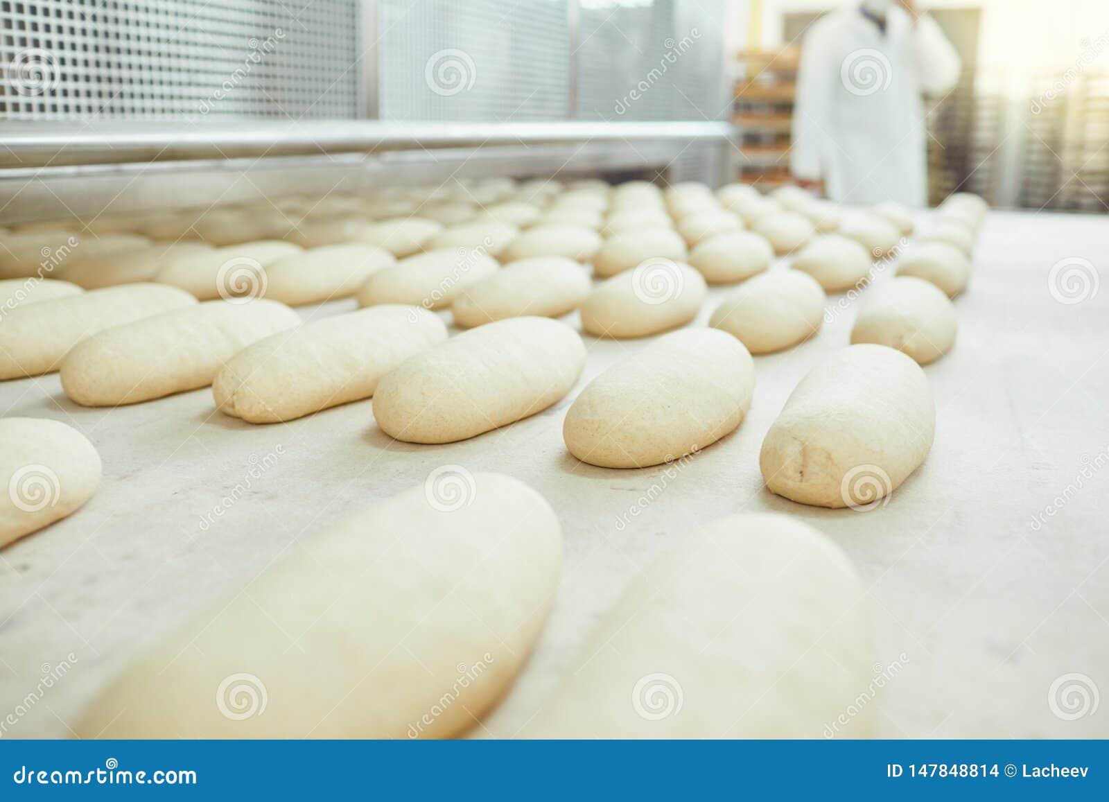 Raw Bread is Making on the Automatic Equipment Line in the Bakery ...