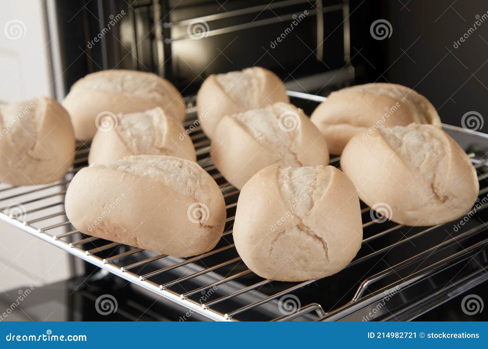 Raw buns on oven rack stock image. Image of dough, loaf - 214982721