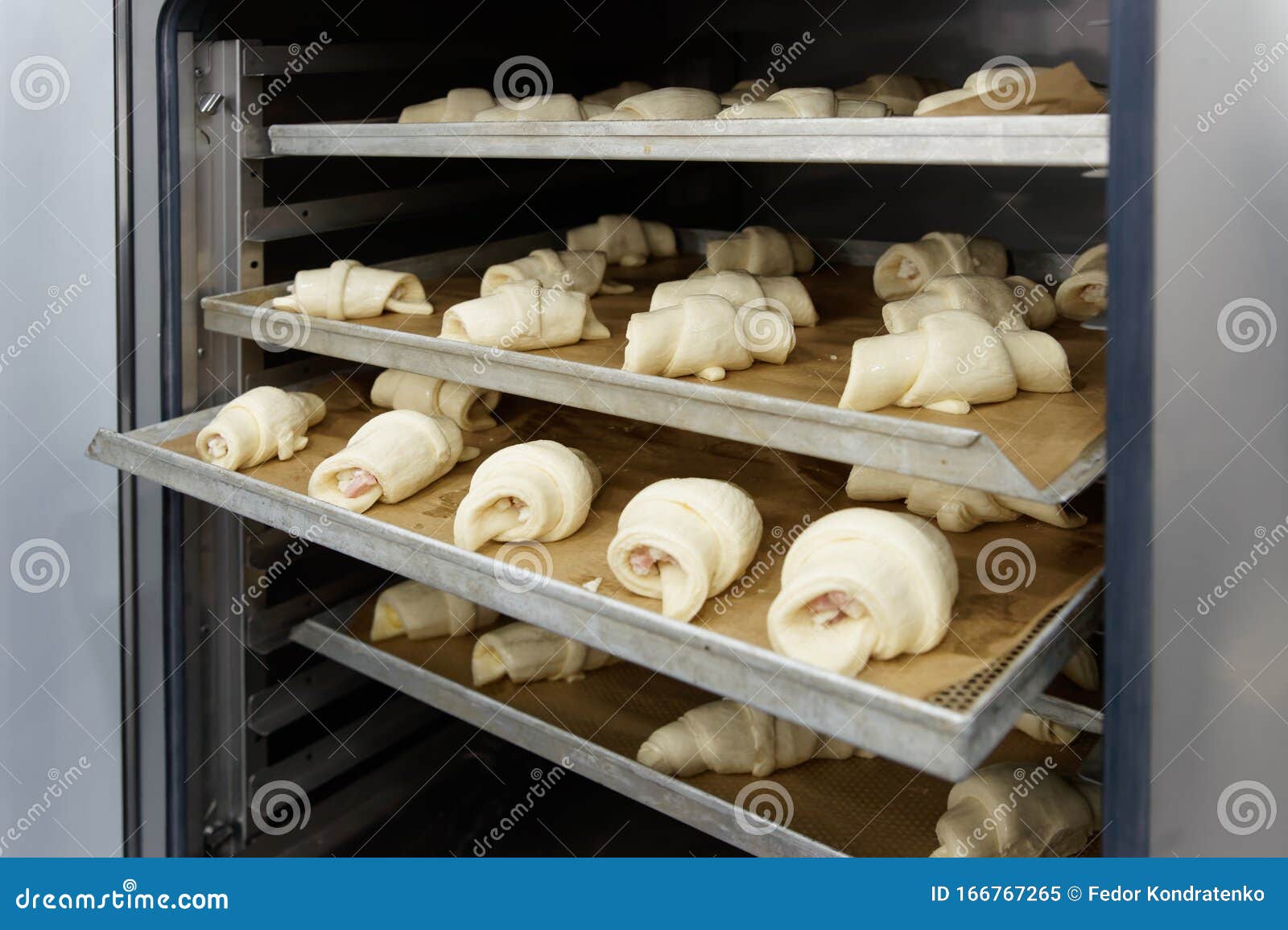 Raw Buns in Proofing Chamber Stock Image - Image of croissant, metal ...