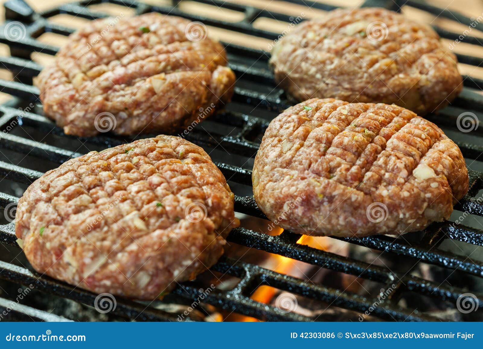 Raw Burgers on Barbecue Grill with Fire Stock Photo - Image of barbecue ...