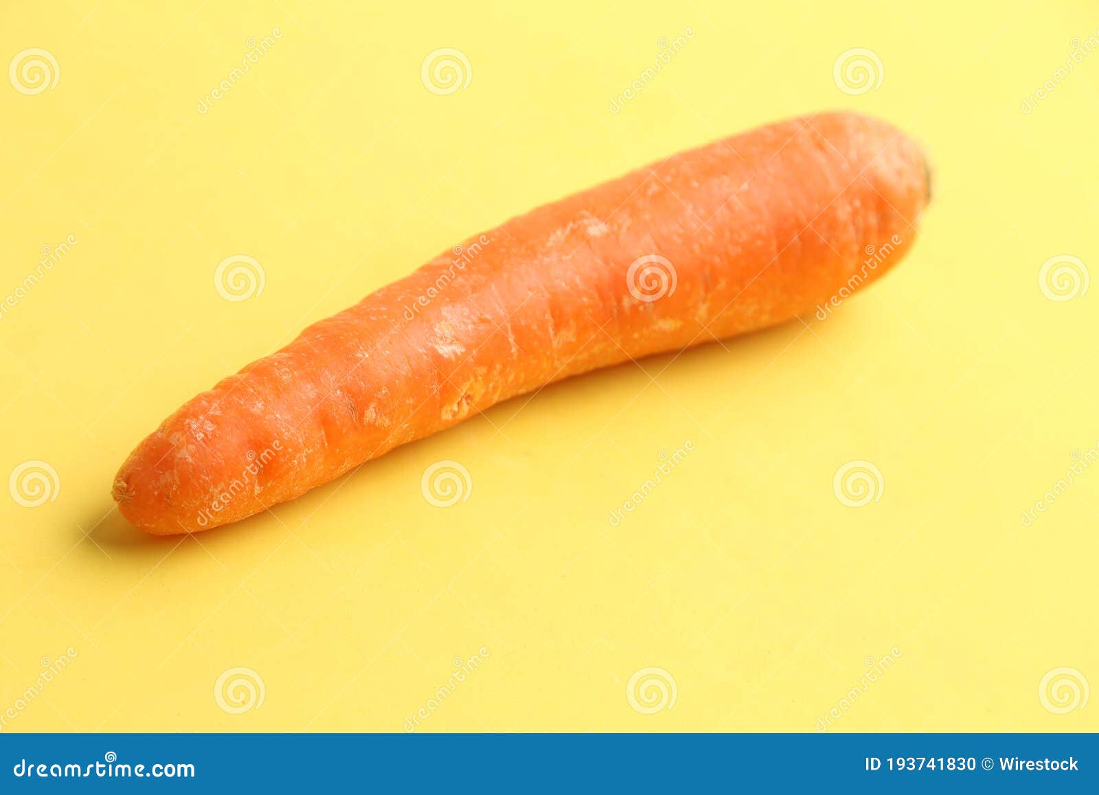Raw Carrot on a Yellow Surface Stock Photo - Image of healthy, organic ...