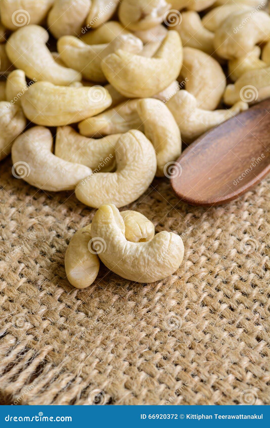 Raw Cashew Nuts with Wooden Spoon Stock Photo - Image of background ...