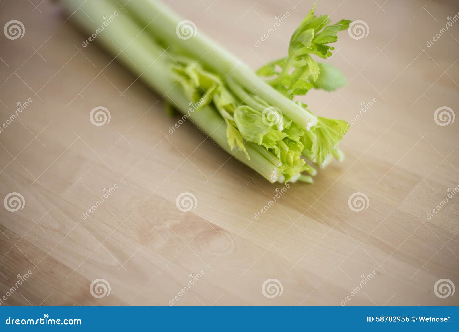Raw celery on wood table stock photo. Image of nature - 58782956